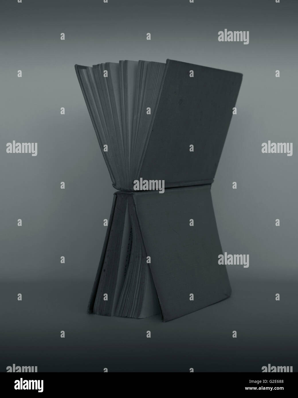 Book Balancing on Book Stock Photo - Alamy