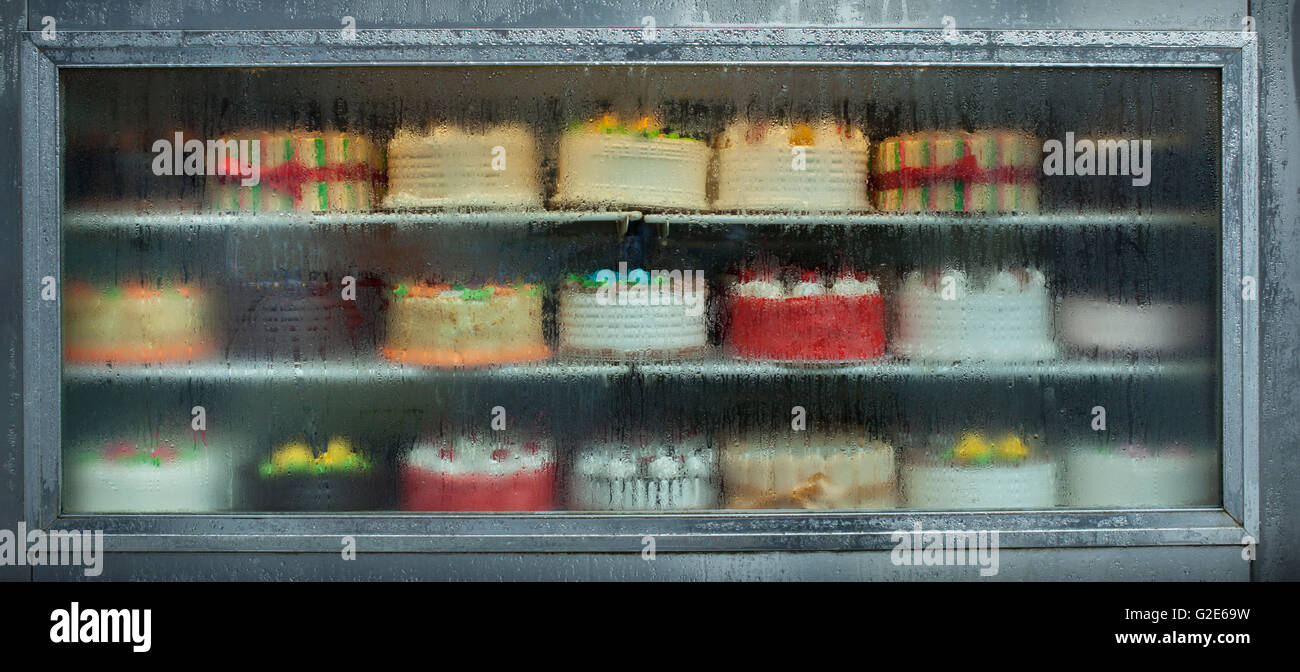 Cakes on Display in Bakery Window Stock Photo - Alamy