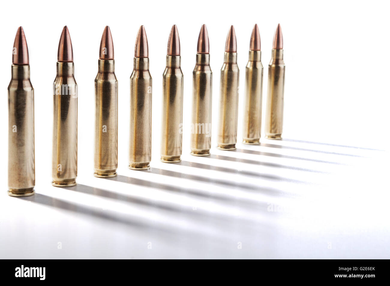Row of shiny rifle bulets isolated on white with shadows Stock Photo ...