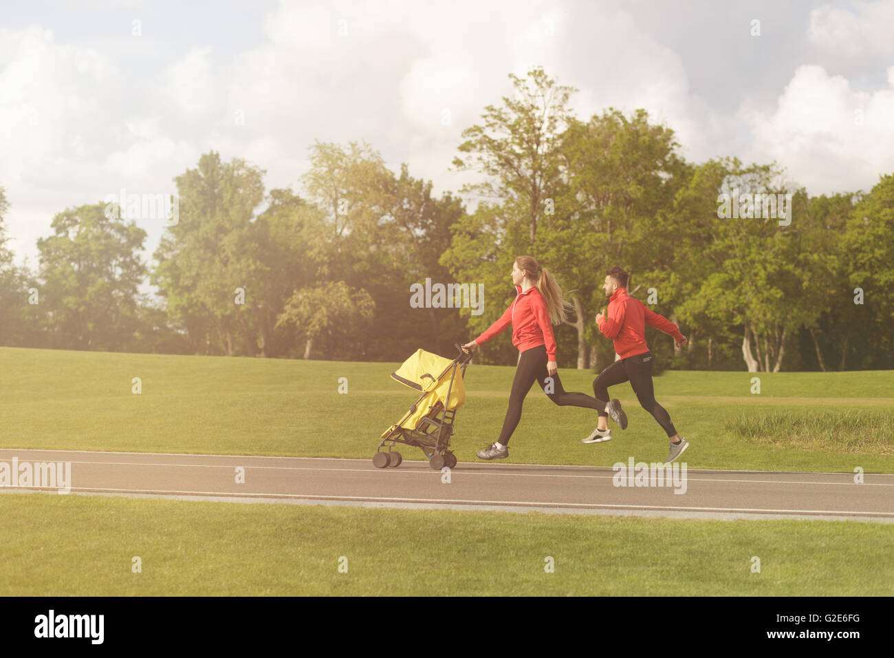 Young parents family playing park hi-res stock photography and images ...