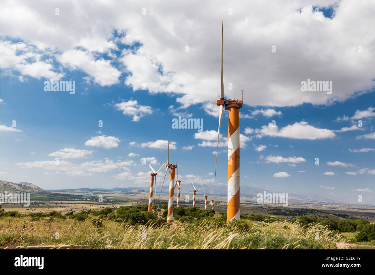 Orange windmill on blue sky background with white clouds Stock Photo ...