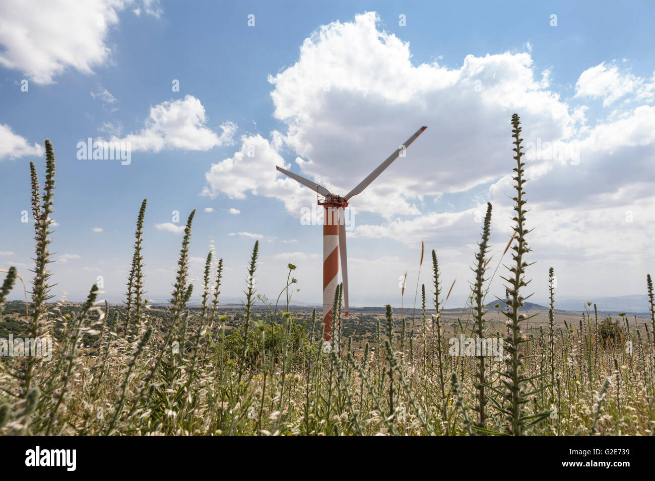 Orange windmill on blue sky background with white clouds Stock Photo ...