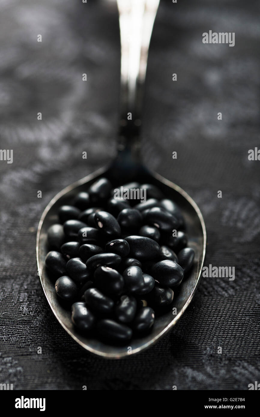 Black Beans in Spoon, Close-Up Stock Photo - Alamy