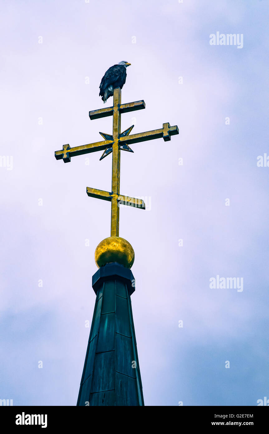 Sitka, Alaska. bald eagles on cross spires of St. Matthew Russian ...