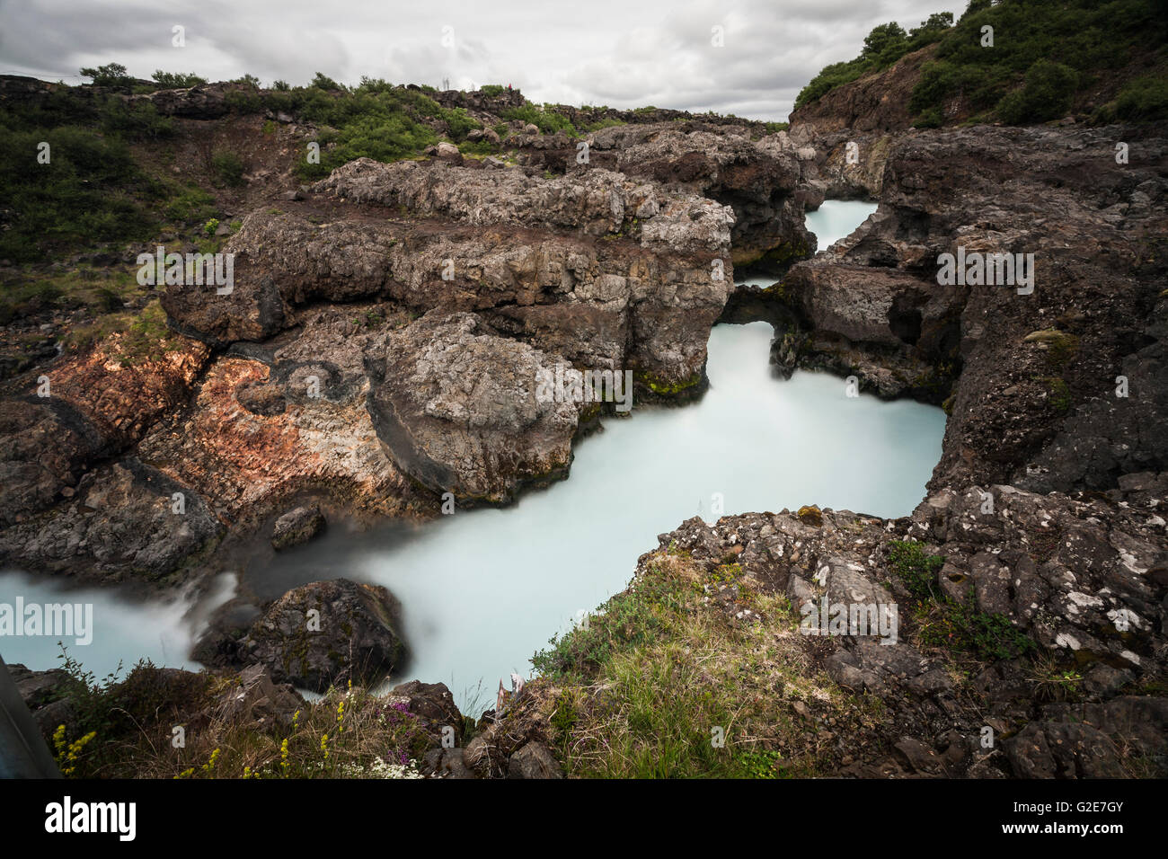 Milky Water in River Surrounded by Lava Rock, Iceland Stock Photo - Alamy