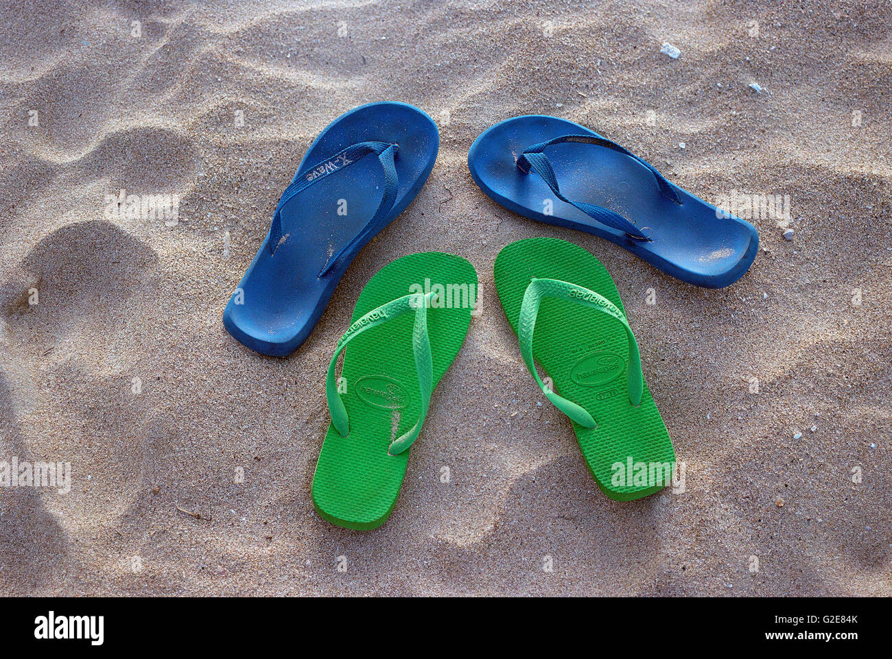 Flip Flops in Sand Stock Photo - Alamy