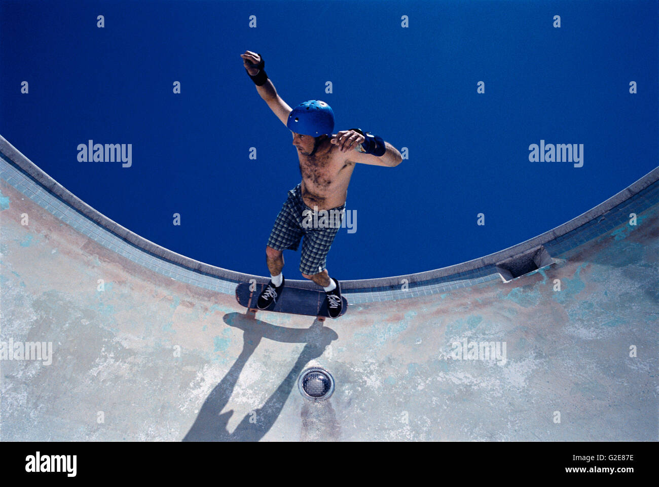 Shirtless Skateboarder in Empty Pool, Low Angle View Stock Photo - Alamy