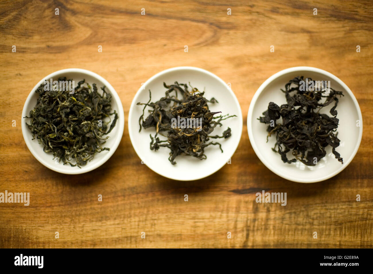Three Tea Plates on Wooden Surface Stock Photo - Alamy