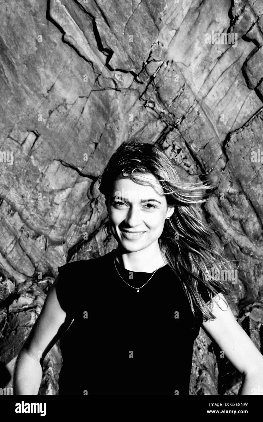 Smiling Woman Against Cliff, Portrait Stock Photo - Alamy
