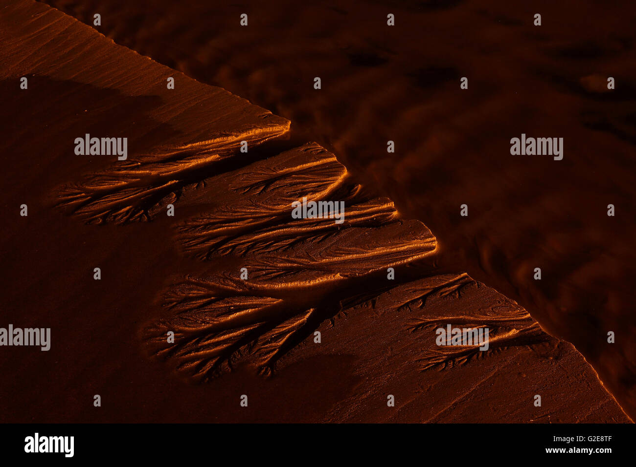Water Making Pattern in Beach Sand Stock Photo - Alamy