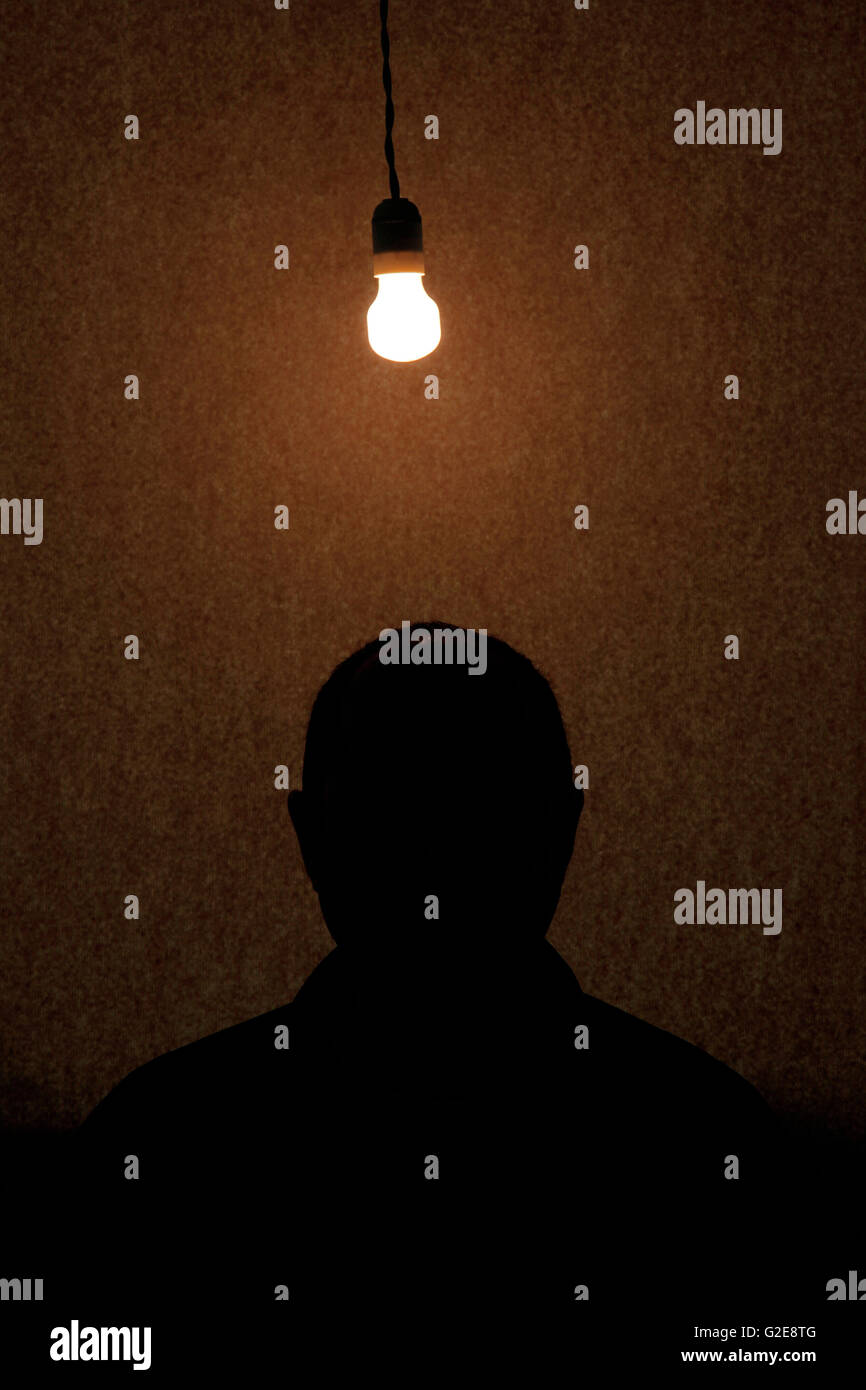 Man Sitting Under Light Bulb, Silhouette Stock Photo - Alamy