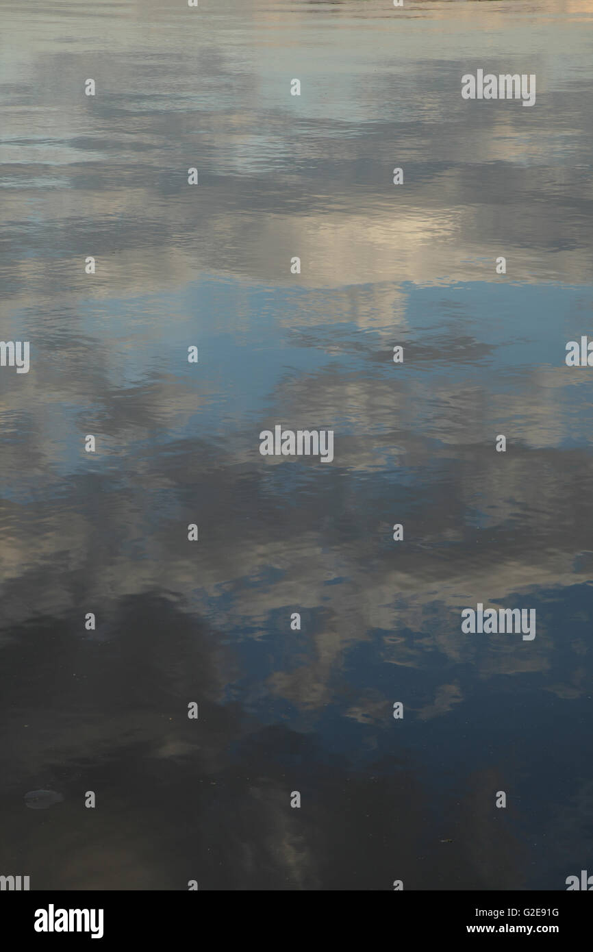 Reflection of Blue Sky and Clouds on Water Stock Photo - Alamy