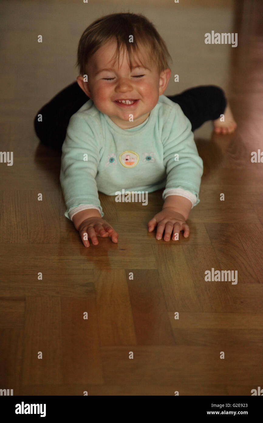 Baby crawling on floor hi-res stock photography and images - Alamy