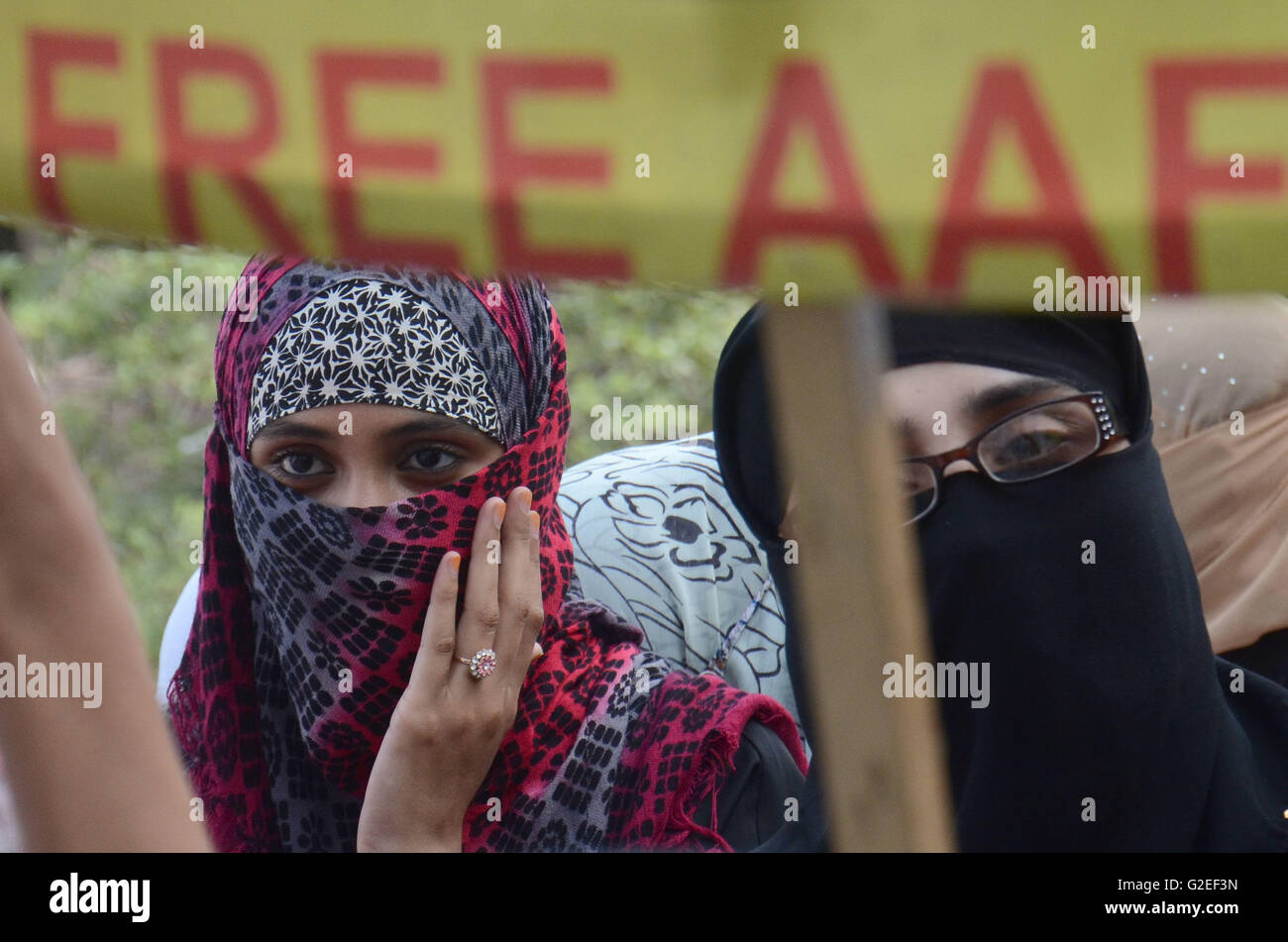 Pakistani activists of "Afia movement" and civil society hold placards ...