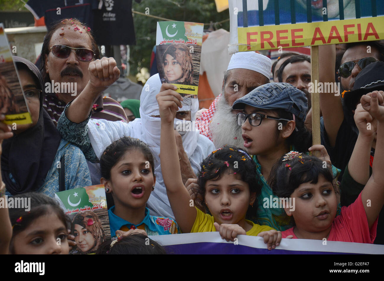 Pakistani activists of "Afia movement" and civil society hold placards ...