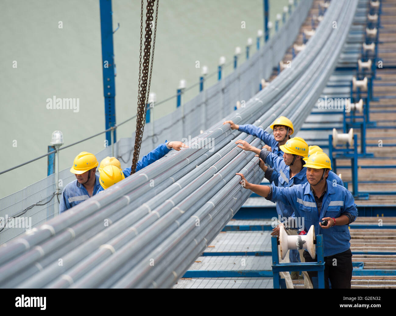 Chongqing, China. 30th May, 2016. Technicians check main cables at the ...