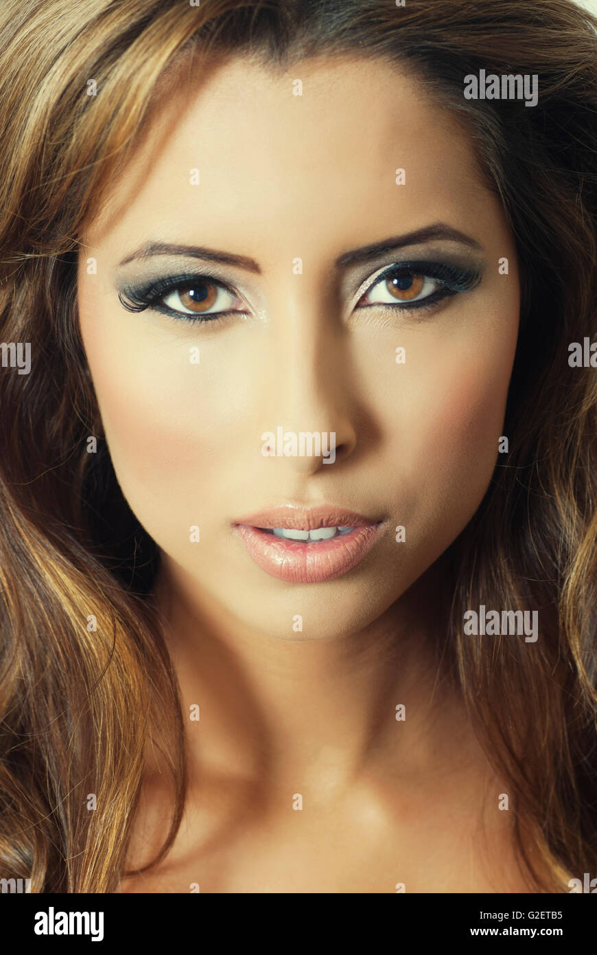 Attractive young woman staring Stock Photo - Alamy