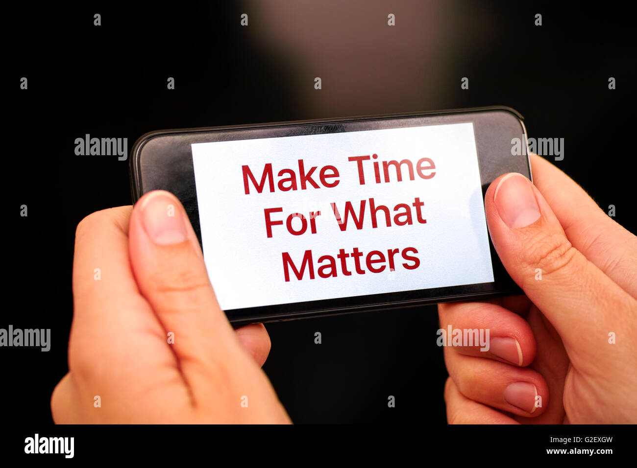 Words Make time for what matters on smart phone display in woman hands ...