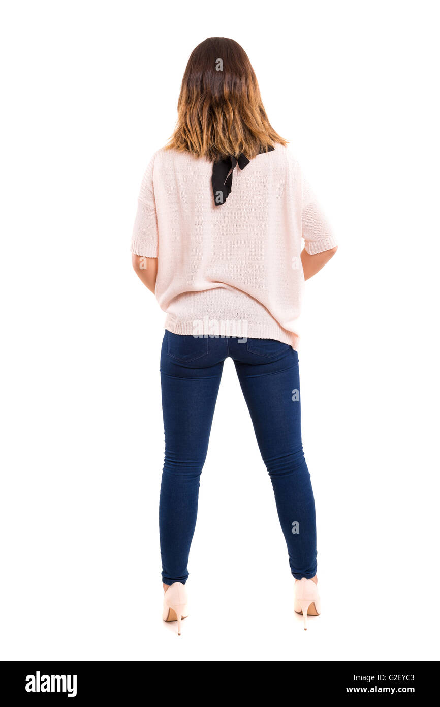 Woman posing with her back faced to camera, isolated over copy space ...