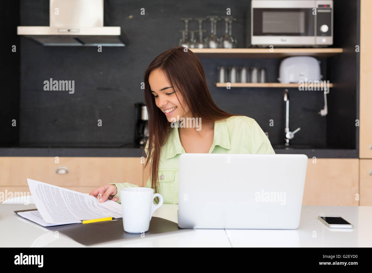 Young woman working at home in the morning Stock Photo - Alamy