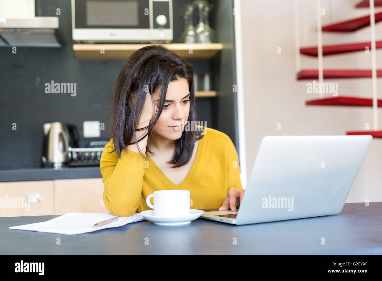 Young woman working at home in the morning Stock Photo - Alamy