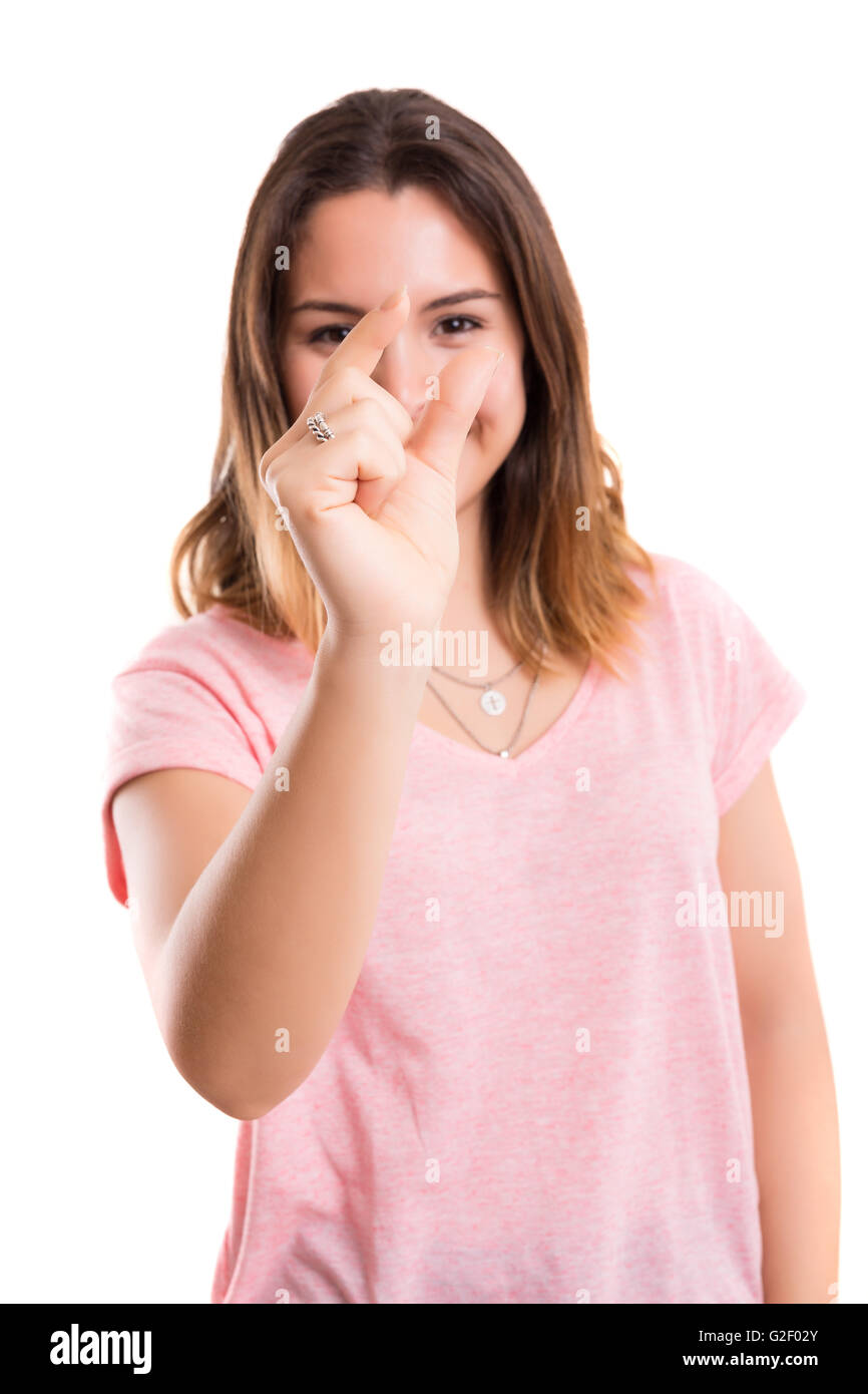 Young woman showing a little, little bit, isolated over white Stock ...