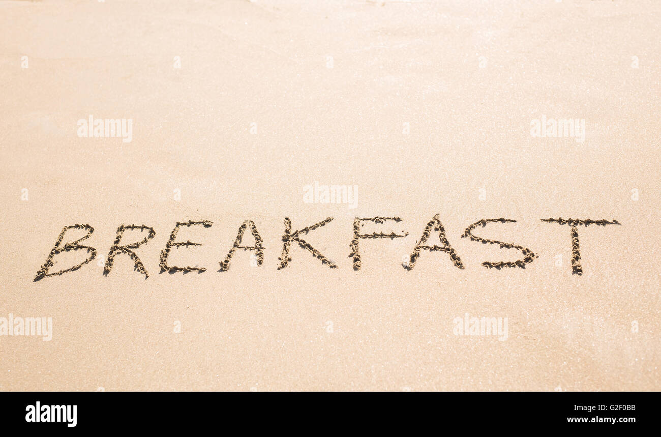 The Word Breakfast Written on the Sand at a Beach Stock Photo - Alamy