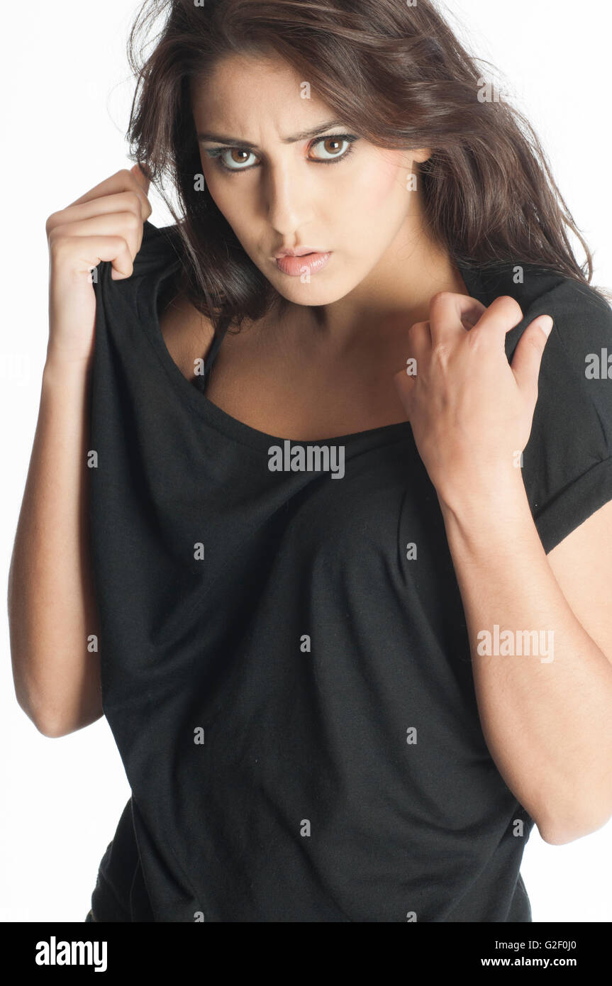 Serious young woman staring Stock Photo - Alamy