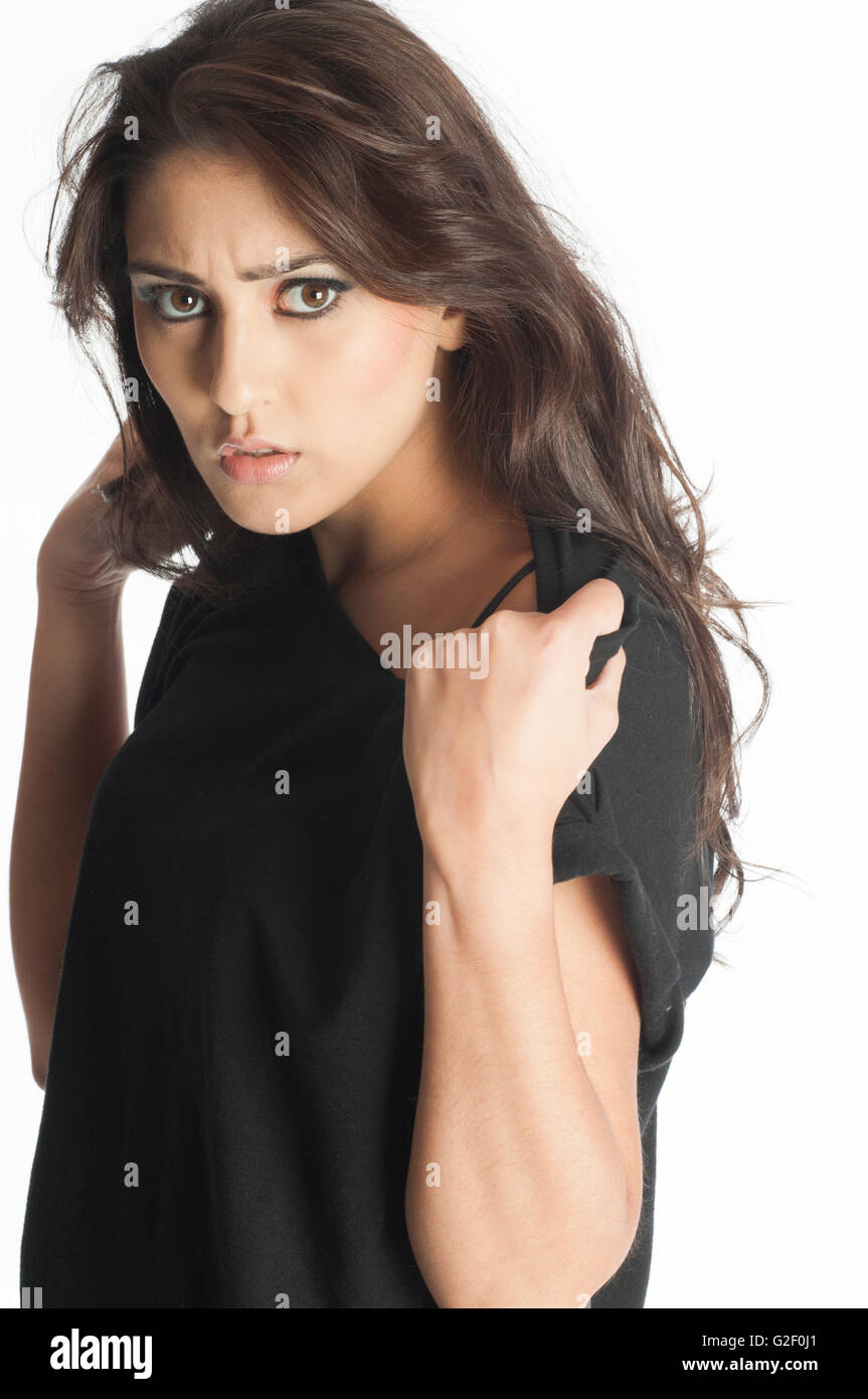 Serious young woman staring Stock Photo - Alamy