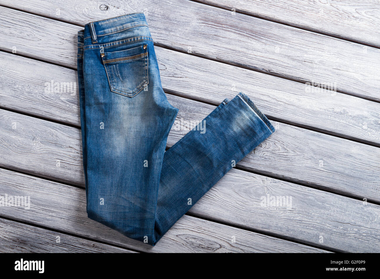 Folded blue jeans Stock Photo - Alamy