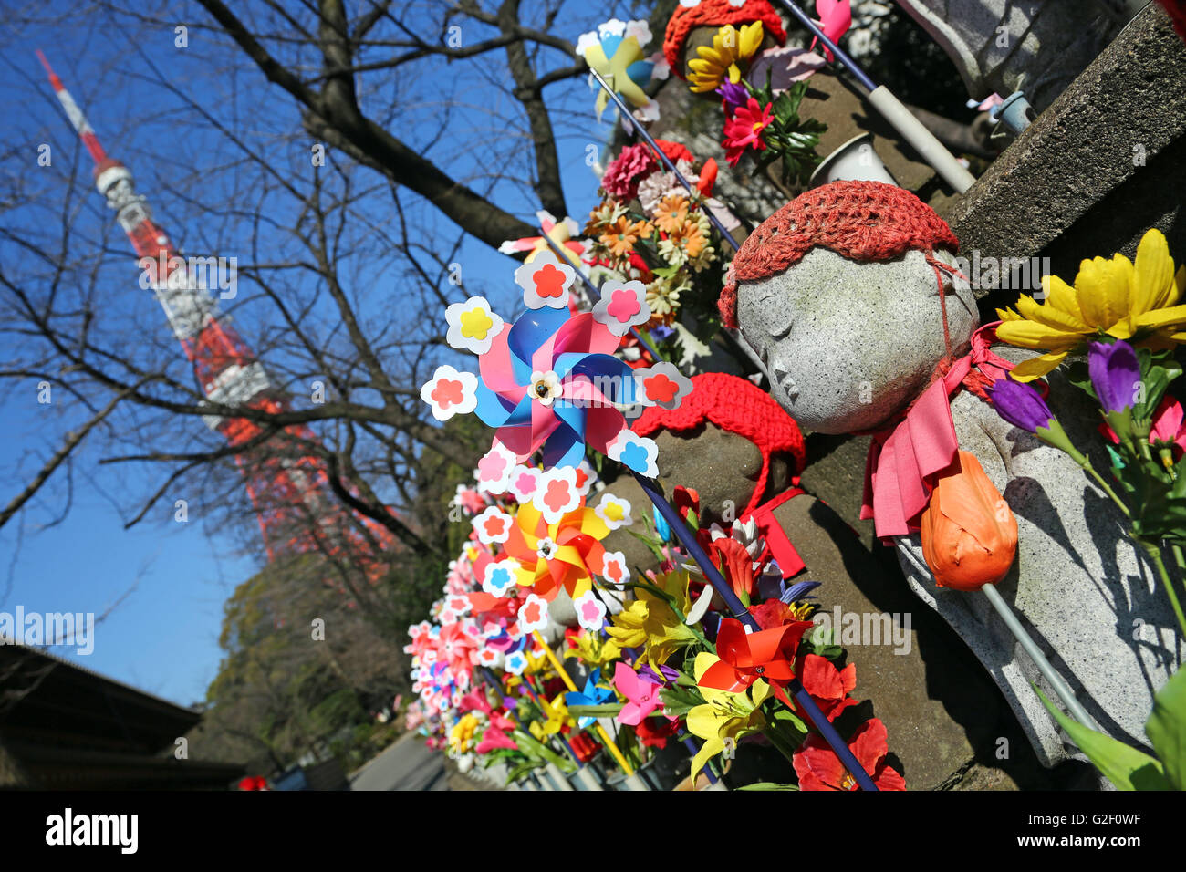 Jizo statues and pinwheel windmill toys in the Zojoji Temple cemetery ...