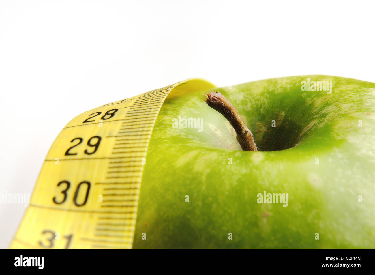 apple and measuring tape isolated for a healthy lifestyle Stock Photo ...