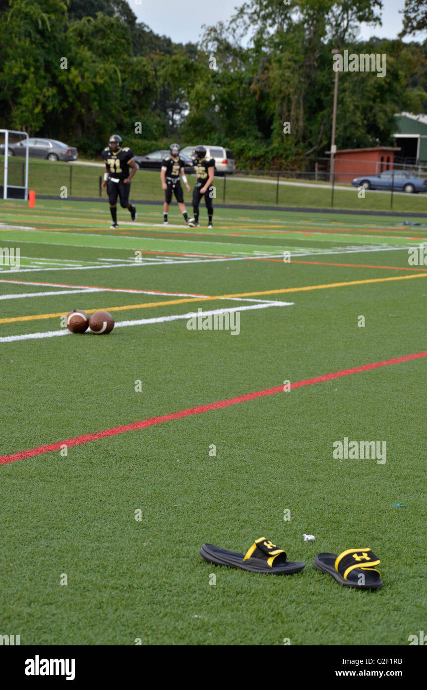 flip flops on a football field Stock Photo - Alamy