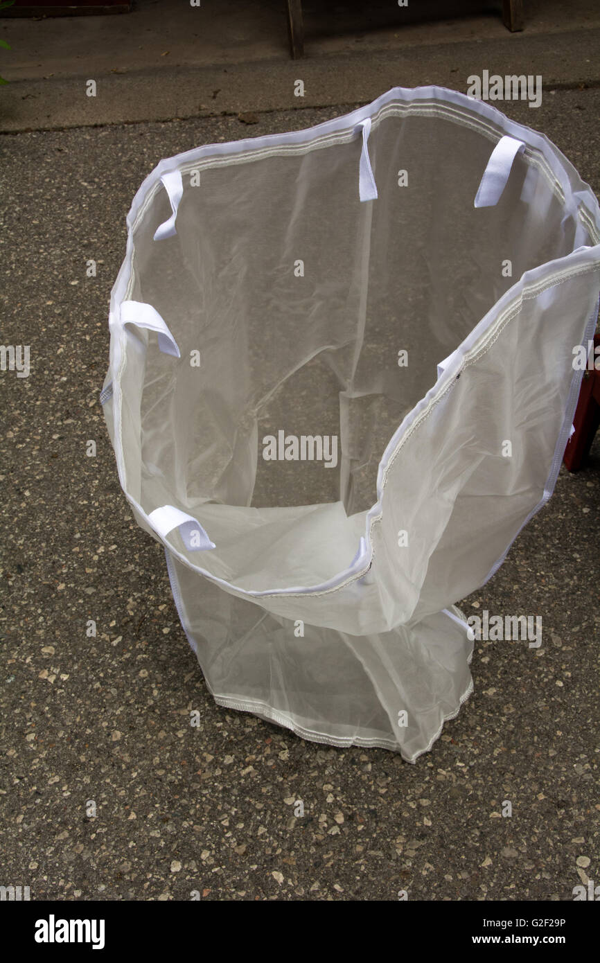 Cheese cloth bag used to mash grains for amateur beer brewing Stock ...