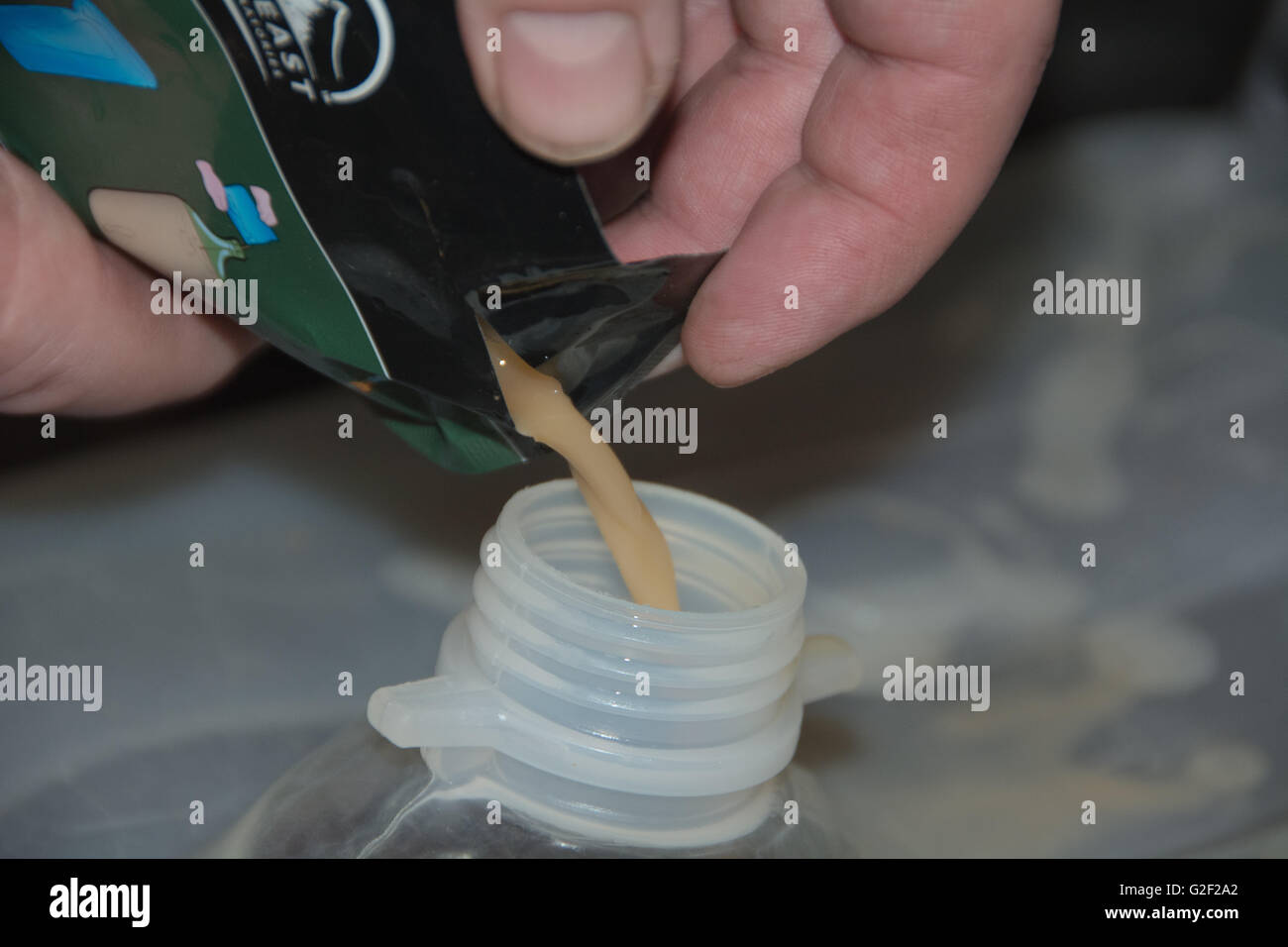 A liquid active yeast culture being pitched into a fermentation ...