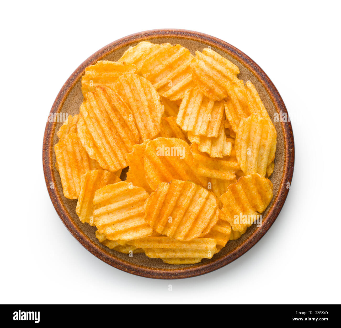 Crinkle cut potato chips isolated on white background. Tasty spicy ...