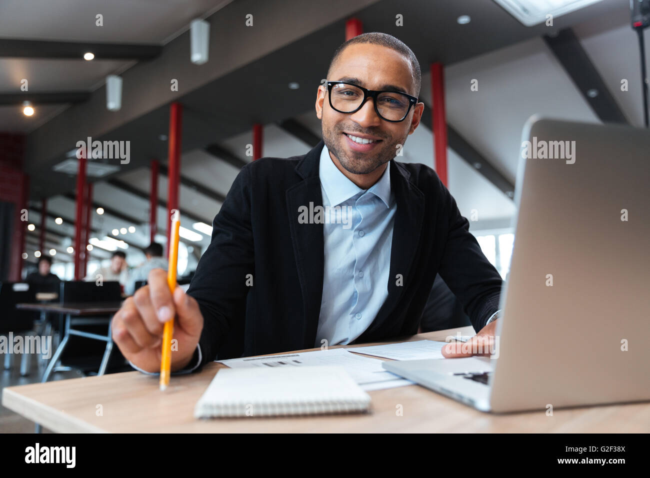Happy people holding pencil hi-res stock photography and images - Alamy
