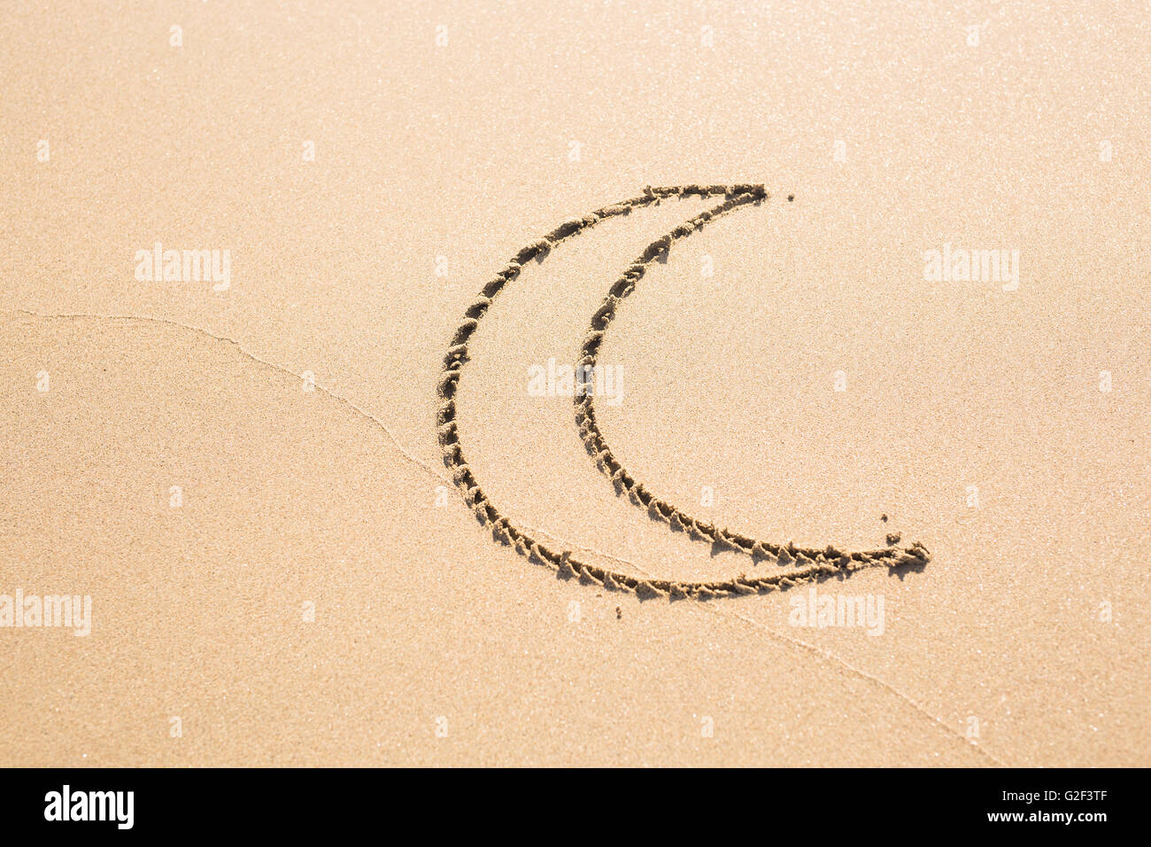 Moon on the sand Stock Photo - Alamy