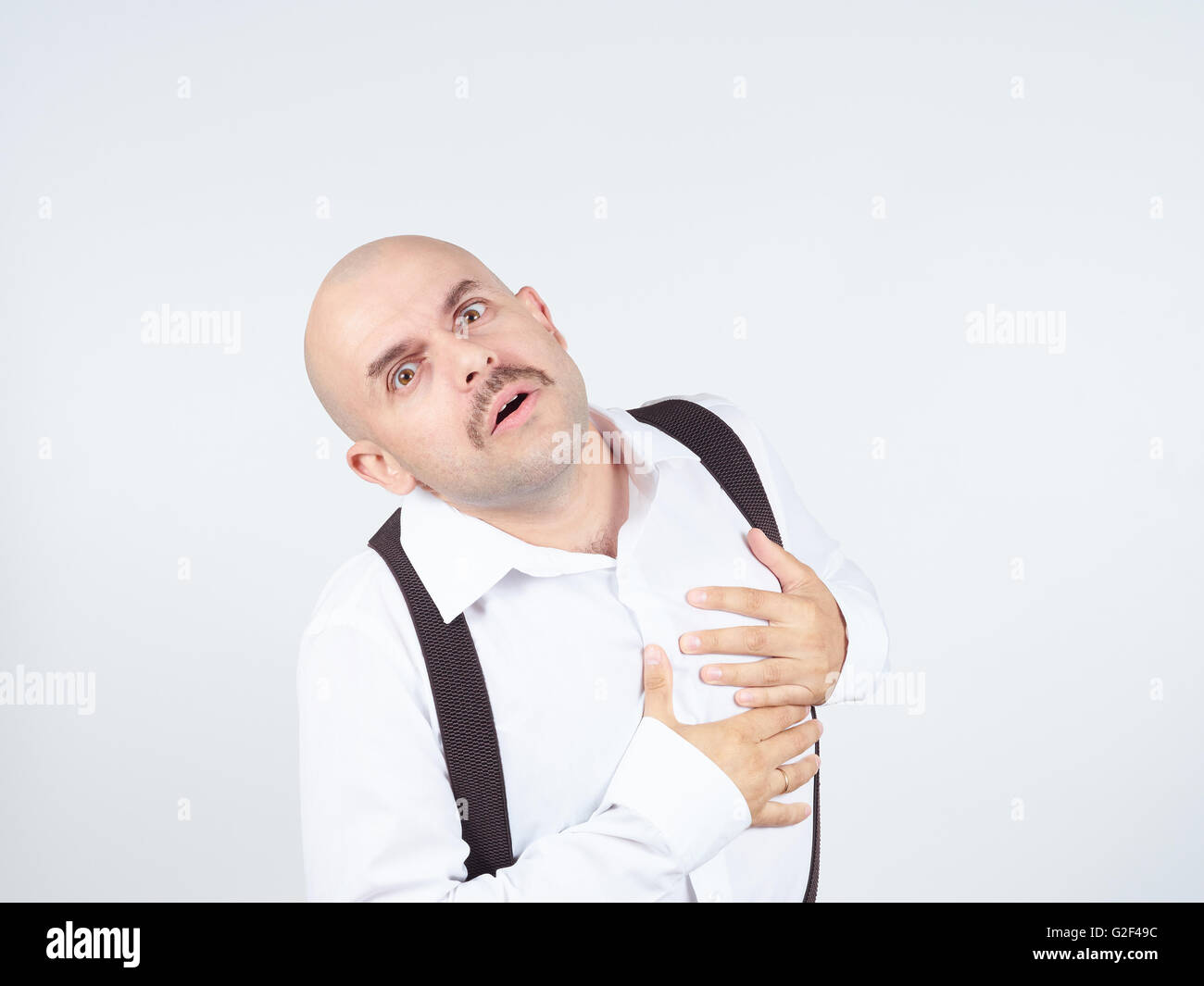 Male heart pain. The bald man with a mustache. Cardio. Heart attack ...