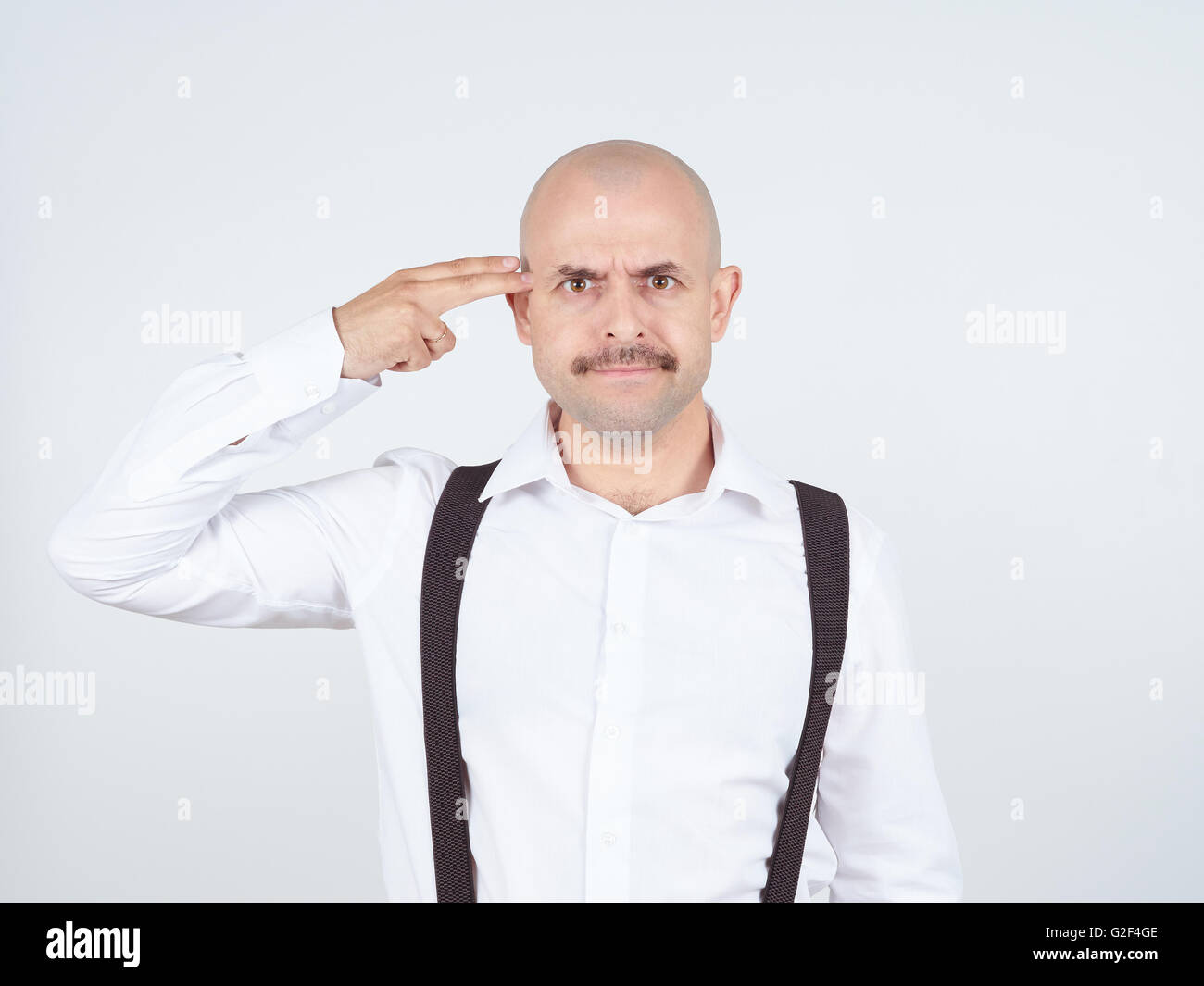 Bald man finger shoot head hi-res stock photography and images - Alamy