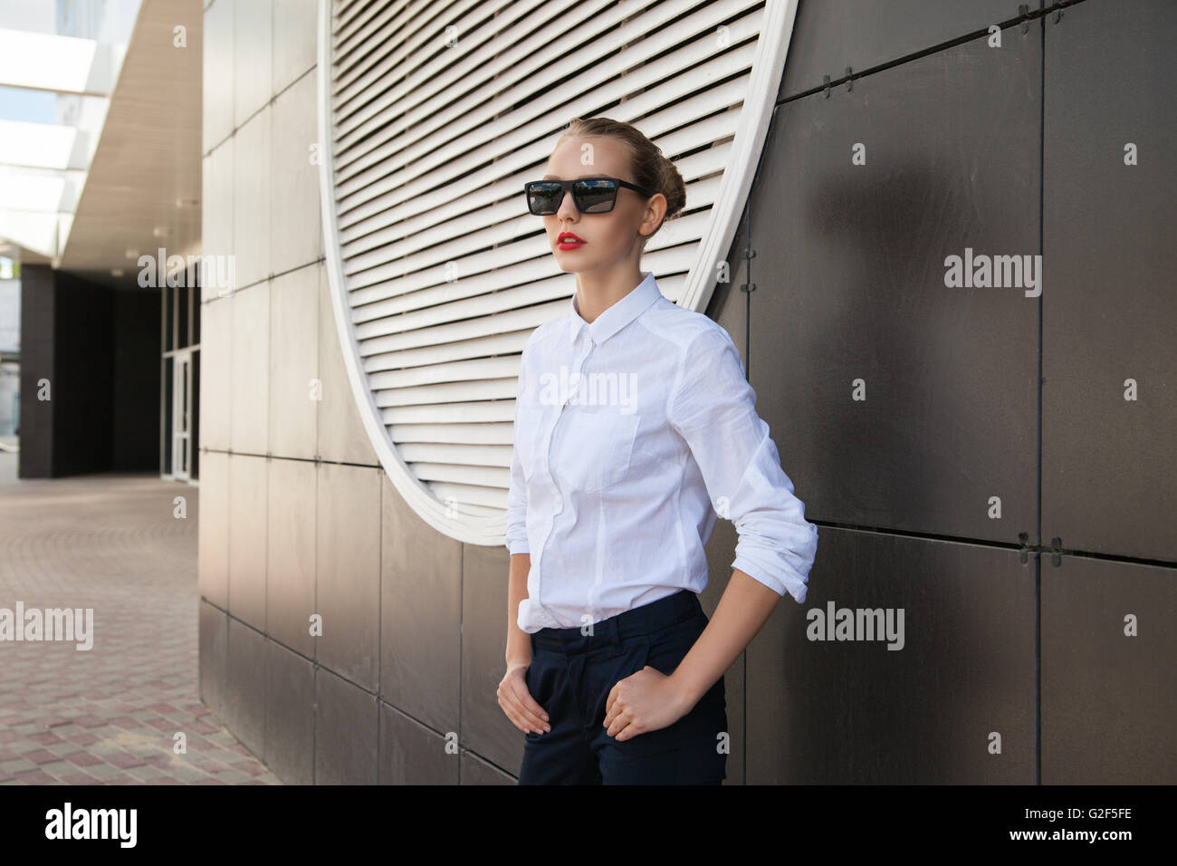 Stylish model in sunglasses looking away Stock Photo - Alamy