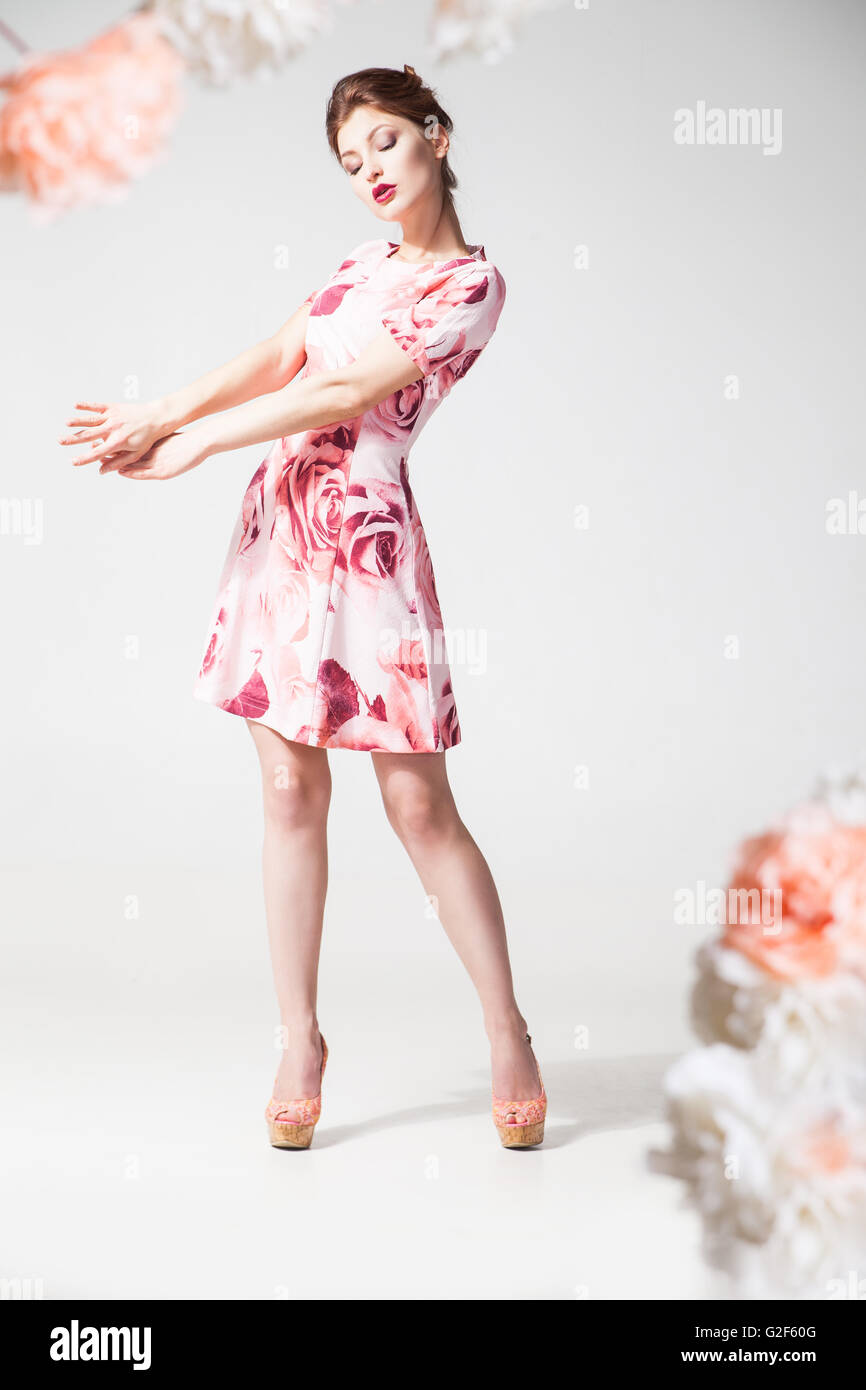 Elegant woman posing in beautiful dress Stock Photo - Alamy