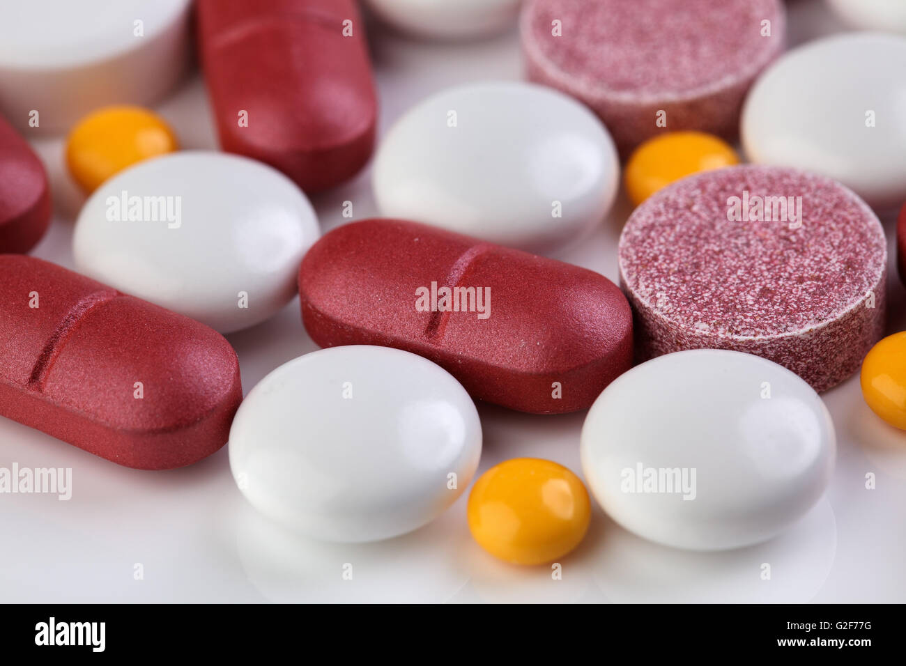 Pile of different types of pills and tablets in various shapes and ...