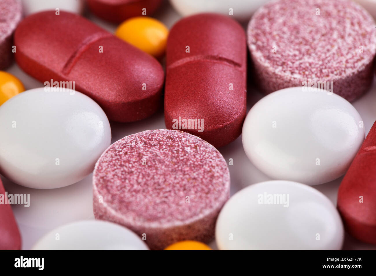 Pile of different types of pills and tablets in various shapes and ...