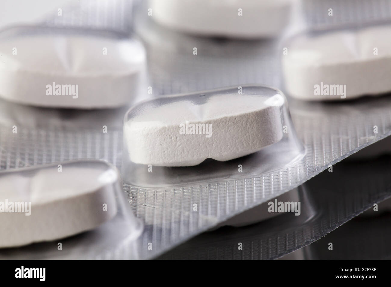 Packaged medicine Pills in aluminium blisters stacked on each other ...