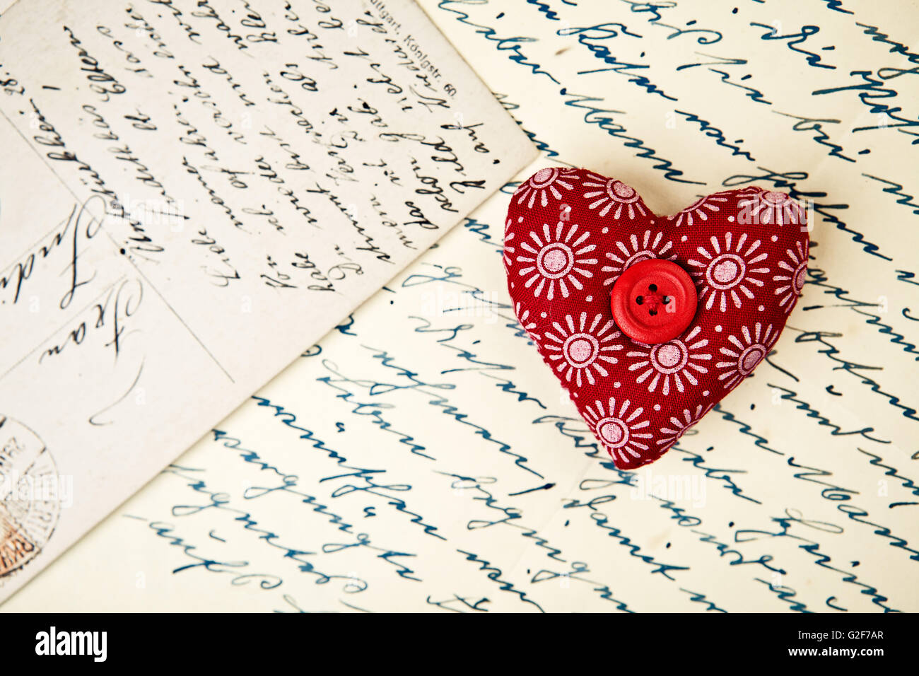 Cloth Hearts on handwritten old Vintage Letters Stock Photo - Alamy