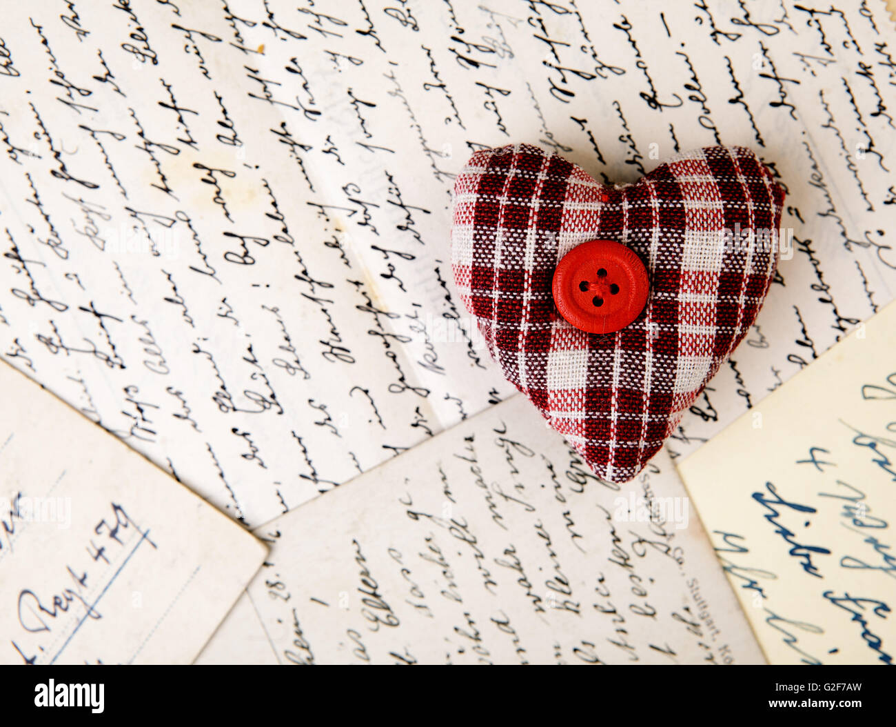 Cloth Hearts on handwritten old Vintage Letters Stock Photo - Alamy