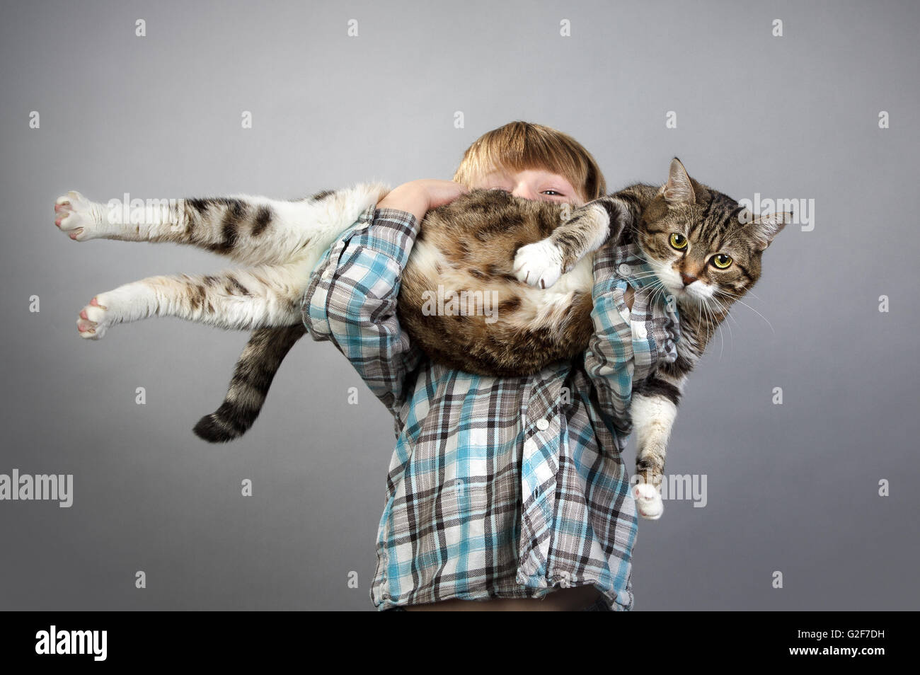 Kid holding black cat hi-res stock photography and images - Alamy