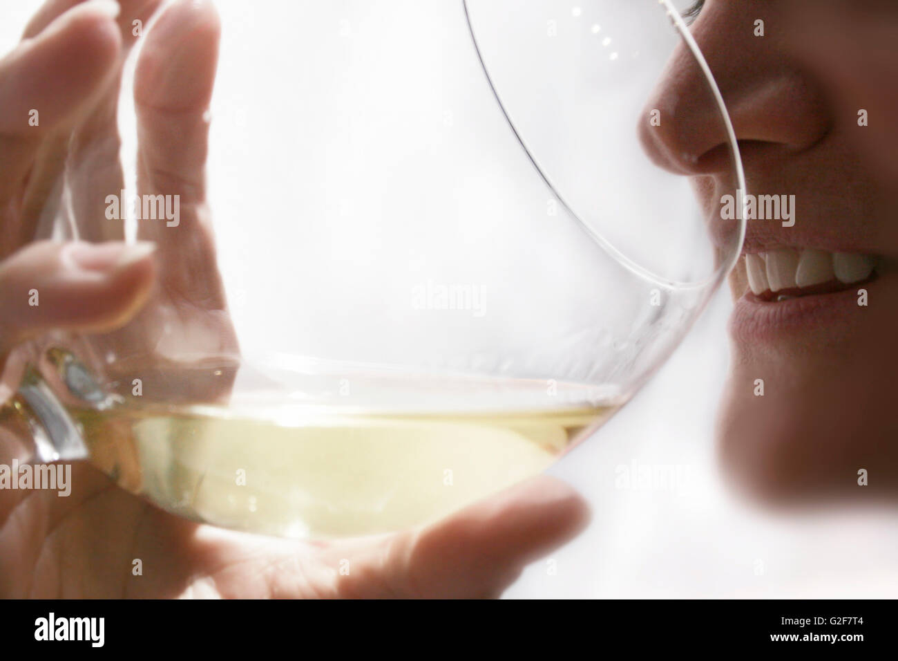 Woman Drinking White Wine Stock Photo - Alamy