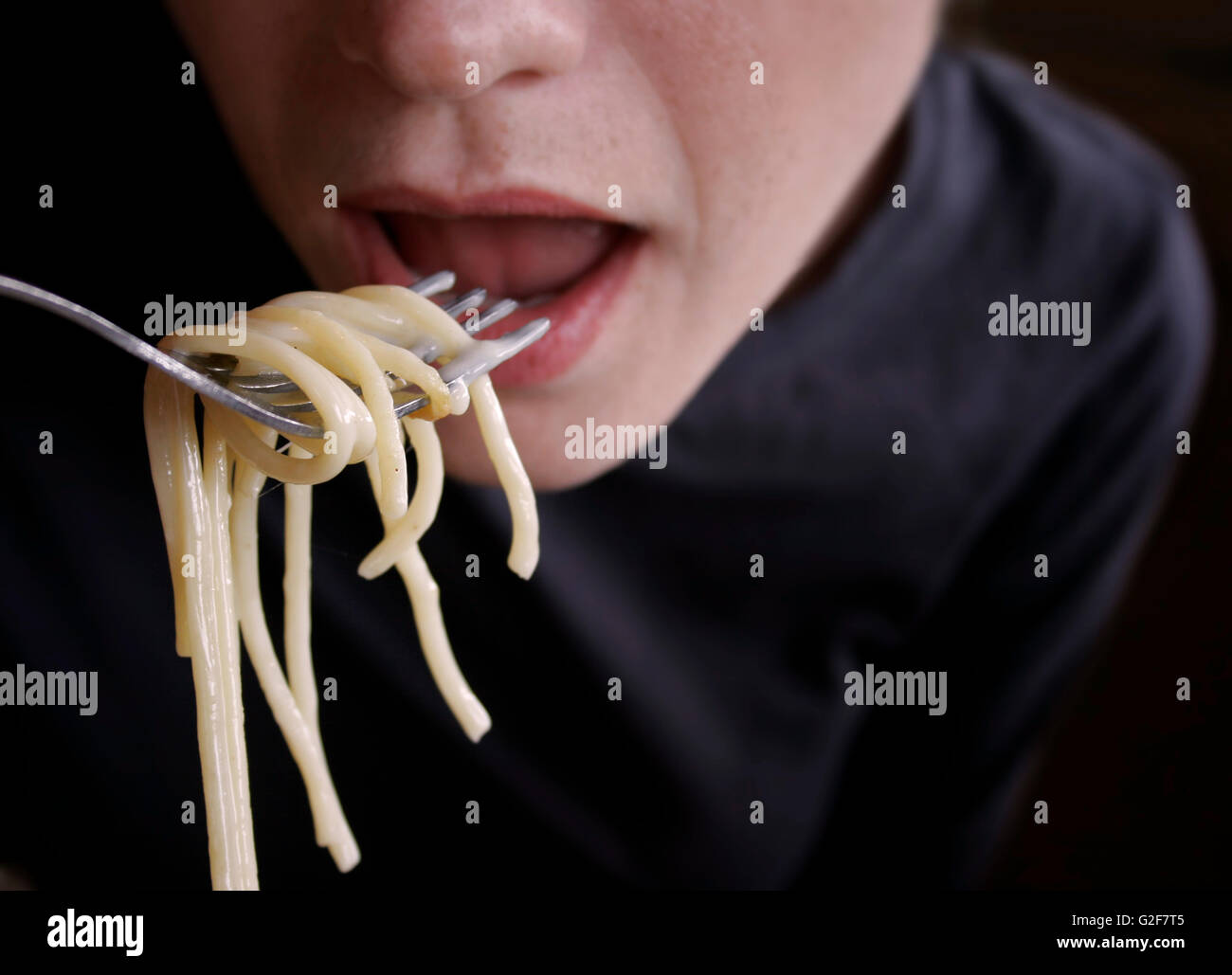 Woman Eating Spaghetti Stock Photo - Alamy